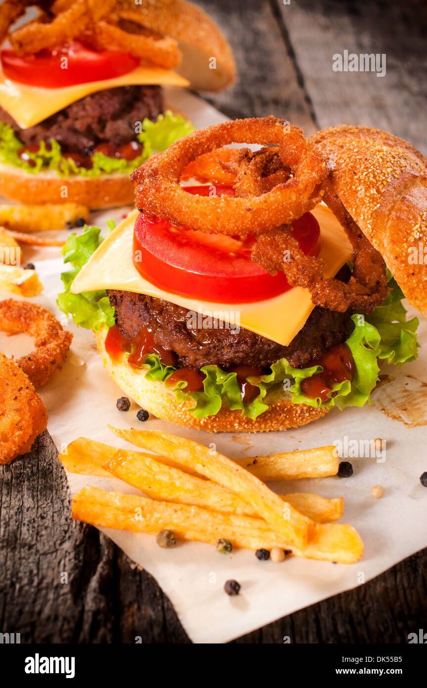 Beef burger with onion rings and french fries.Selective focus on the ...