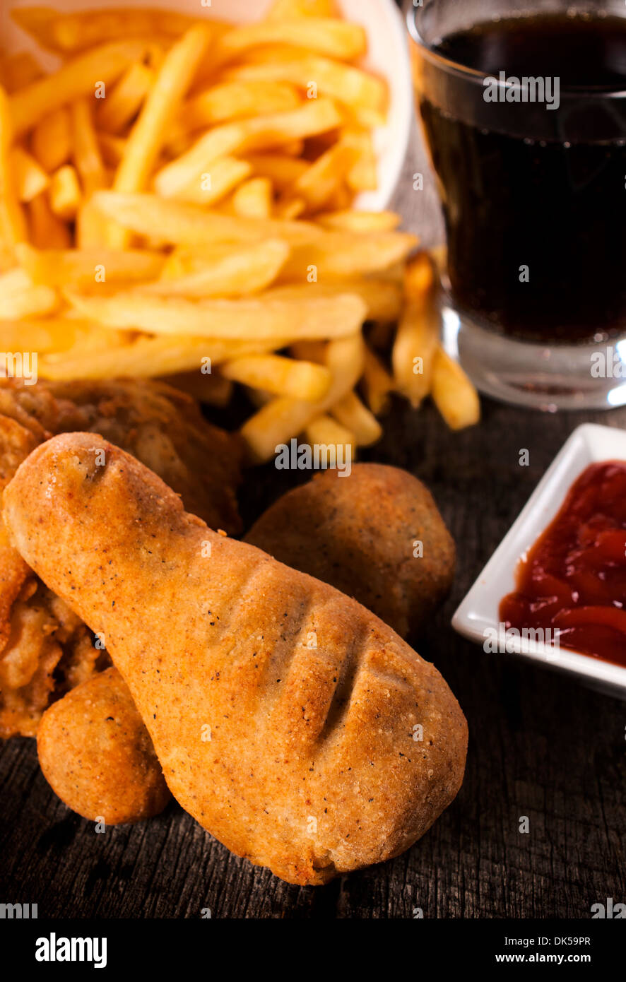 Junk food meal with fried chicken and french fries.Selective focus on ...