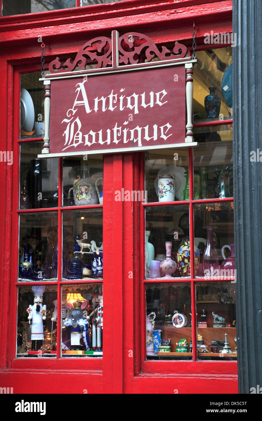 Antique store window with antiques in the window display Stock Photo ...