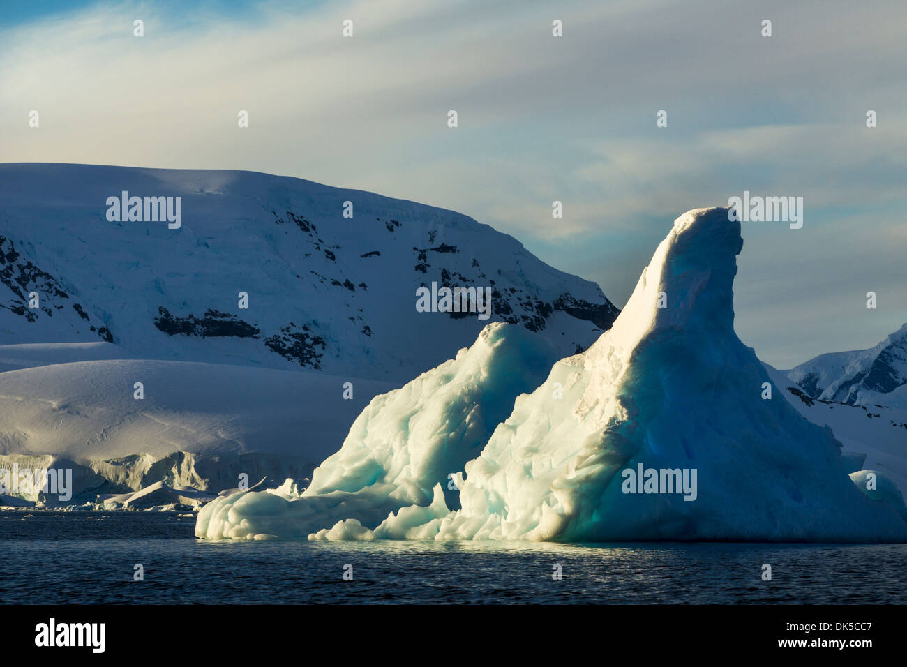 Antarctica, Morning sun lights iceberg floating near Enterprise Island ...