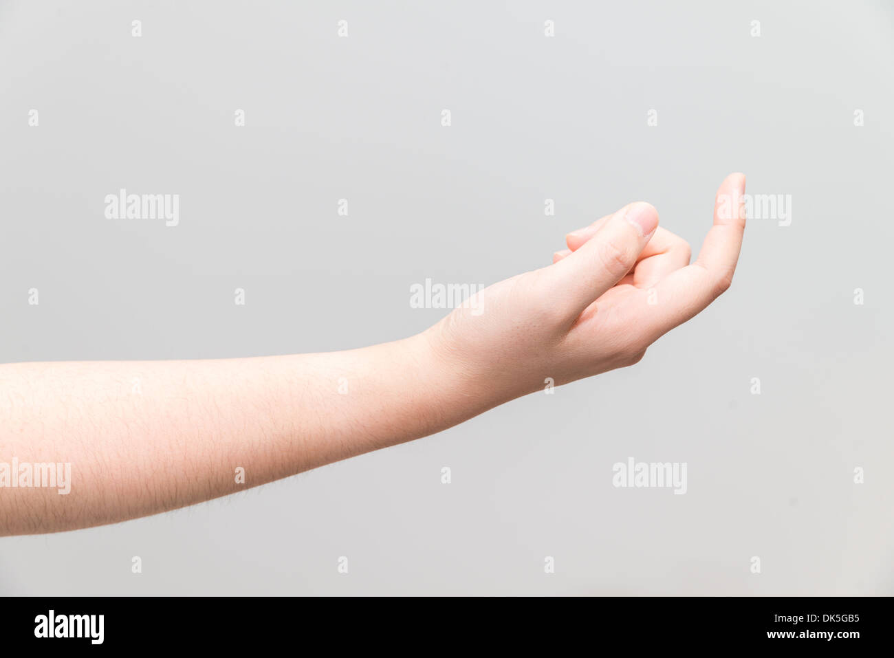 Human hand with curl index finger on light gray background Stock Photo ...
