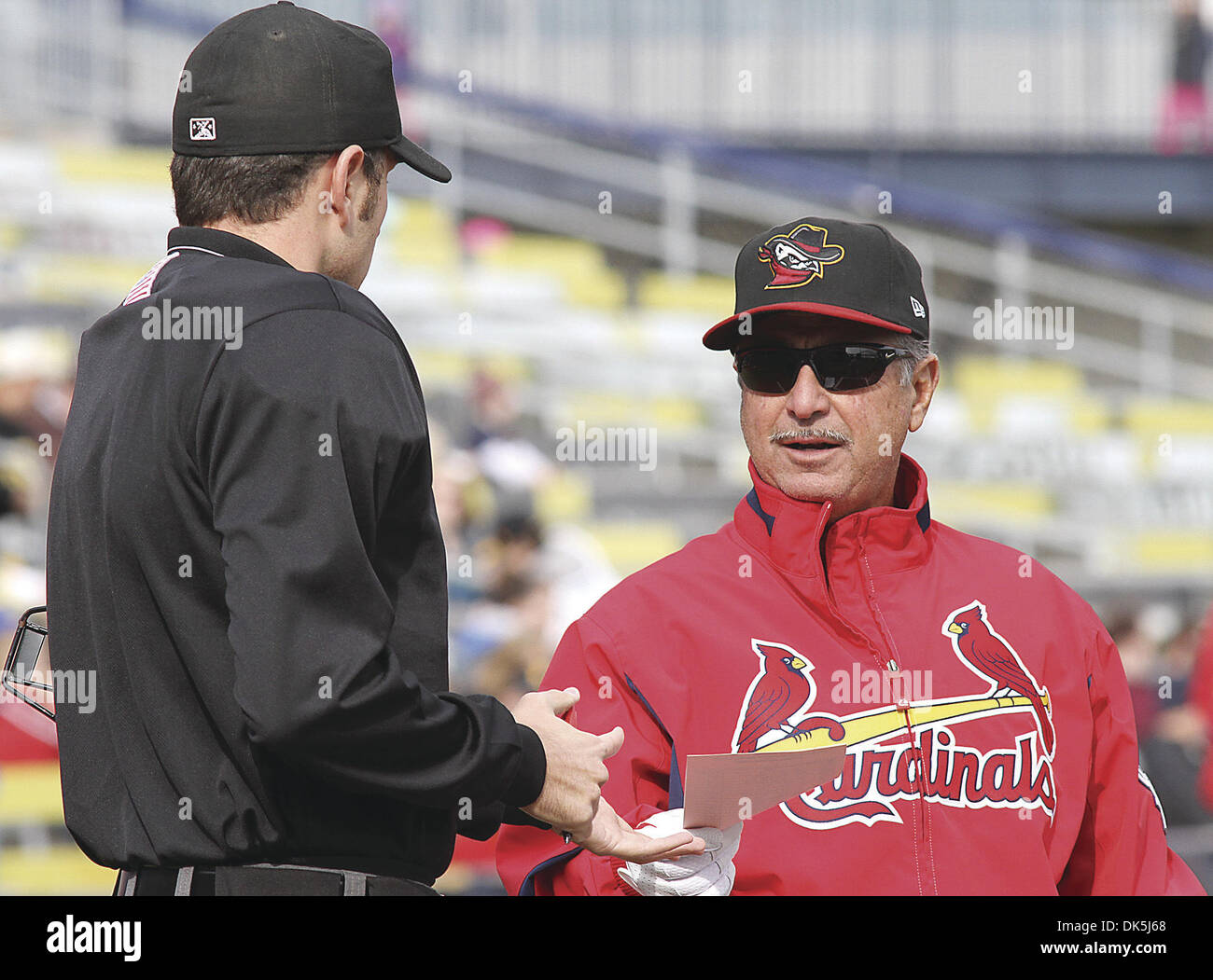 May 1, 2011 - Iowa, U.S. - River Bandits coach Johnny Rodriguez hands ...