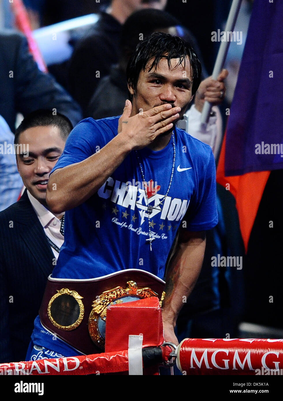 Manny Pacquiao waves to his fans after going 12 rounds with Sugar Shane ...