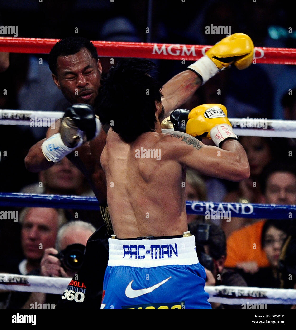 in blue&white trunks) Manny Pacquiao goes 12 rounds with Sugar Shane ... in blue&white trunks) Manny Pacquiao goes 12 rounds with Sugar Shane ...