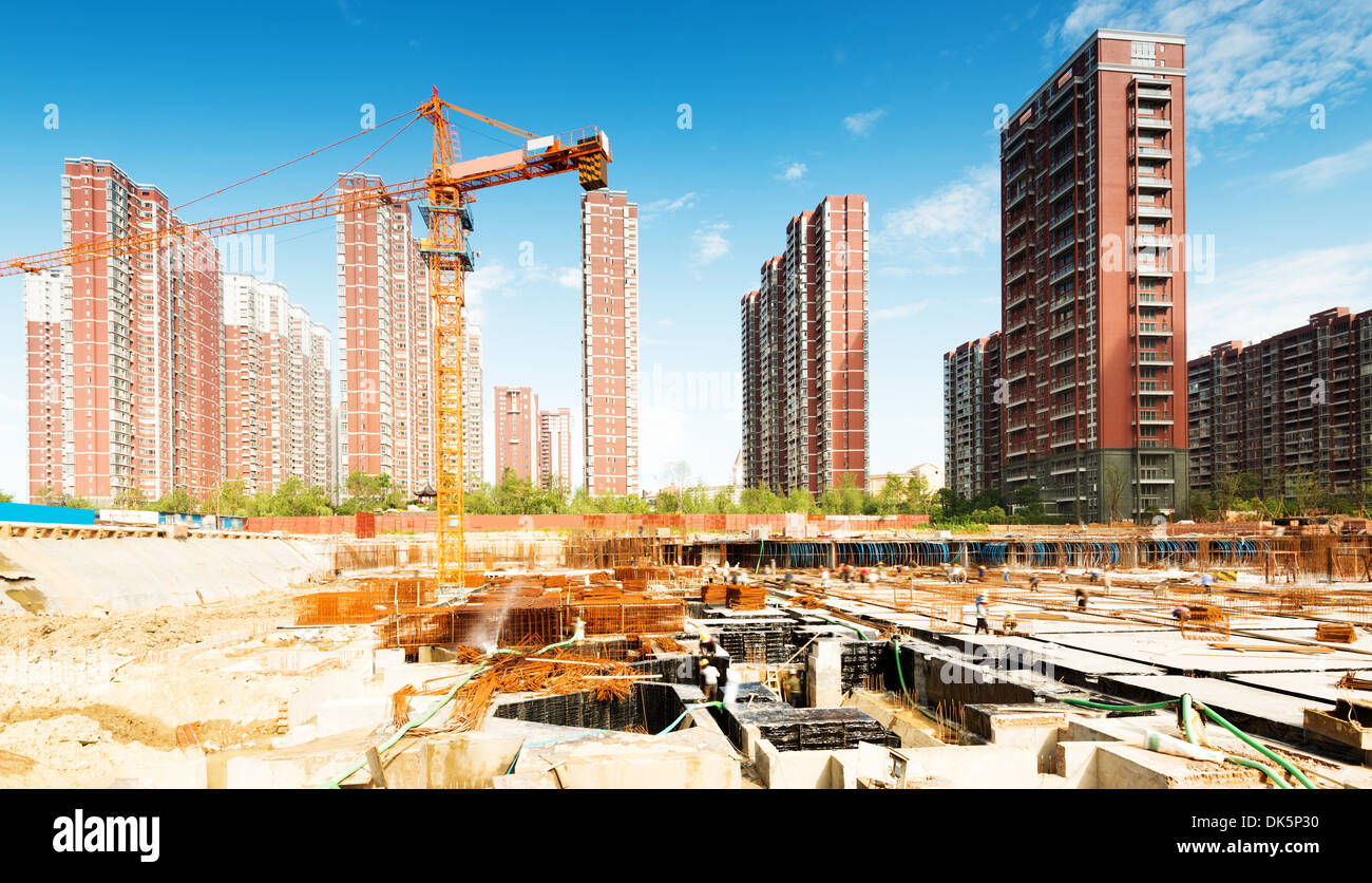 building under construction with workers Stock Photo - Alamy