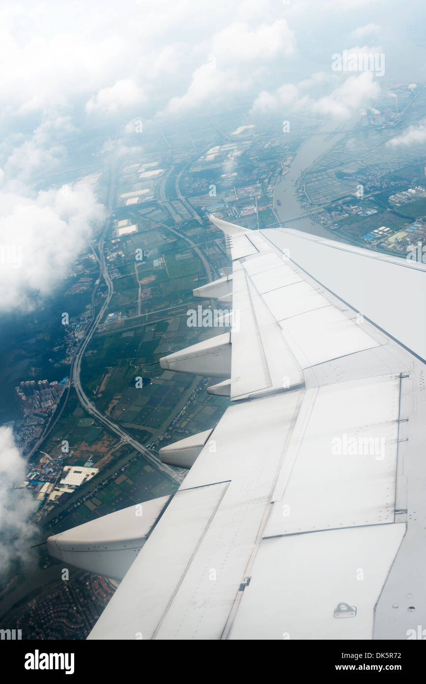 Wing aircraft in altitude during flight Stock Photo - Alamy