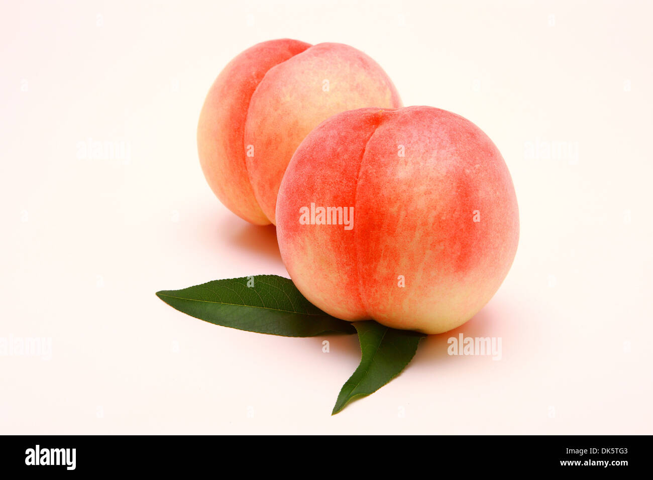 Two peaches hi-res stock photography and images - Alamy