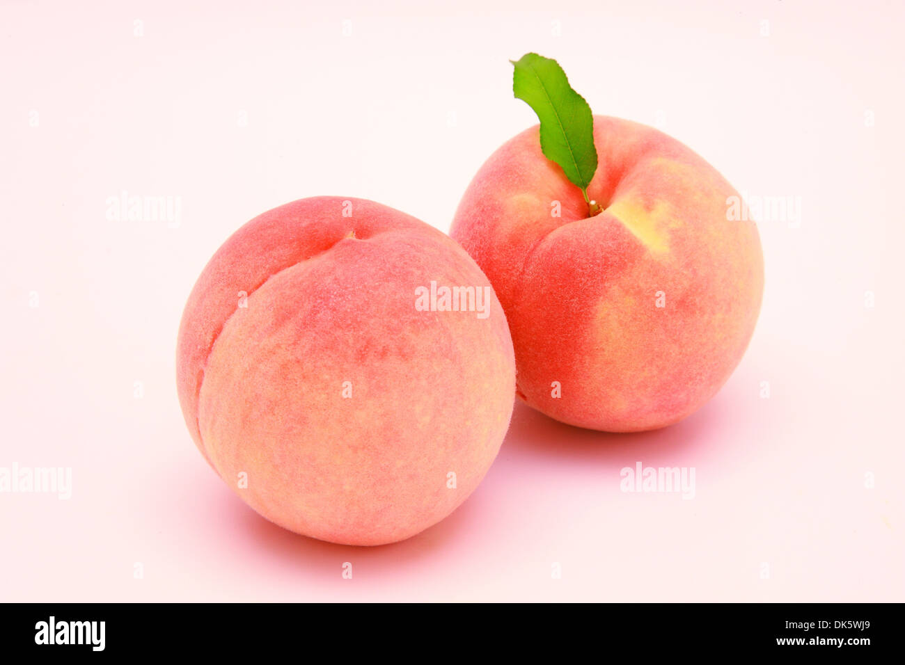 Two whole peaches hi-res stock photography and images - Alamy