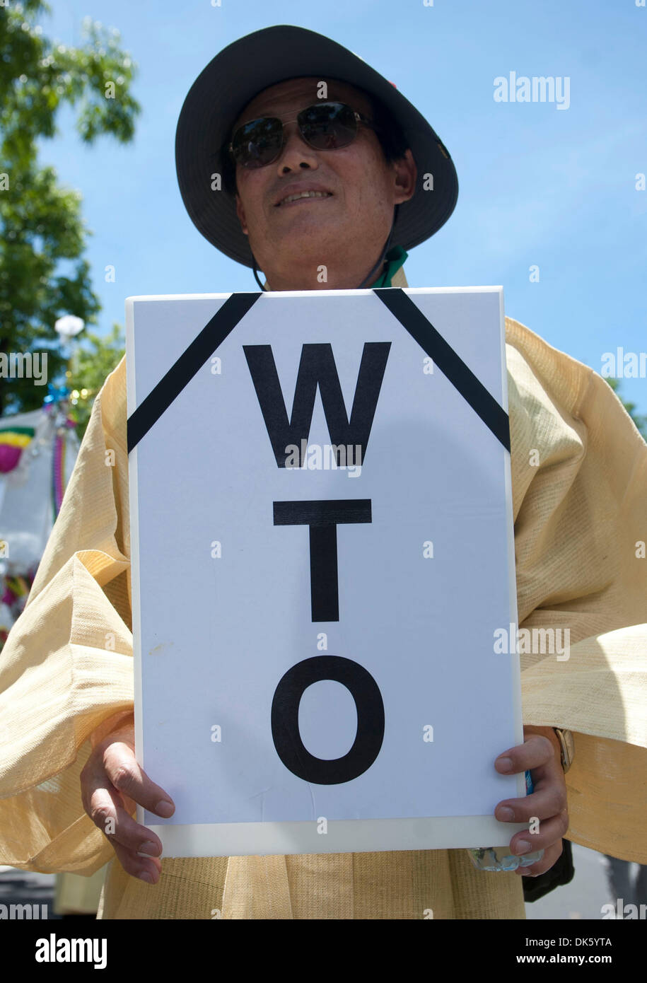 Bali, Indonesia. 3rd Dec, 2013. A man attends a demonstration ...