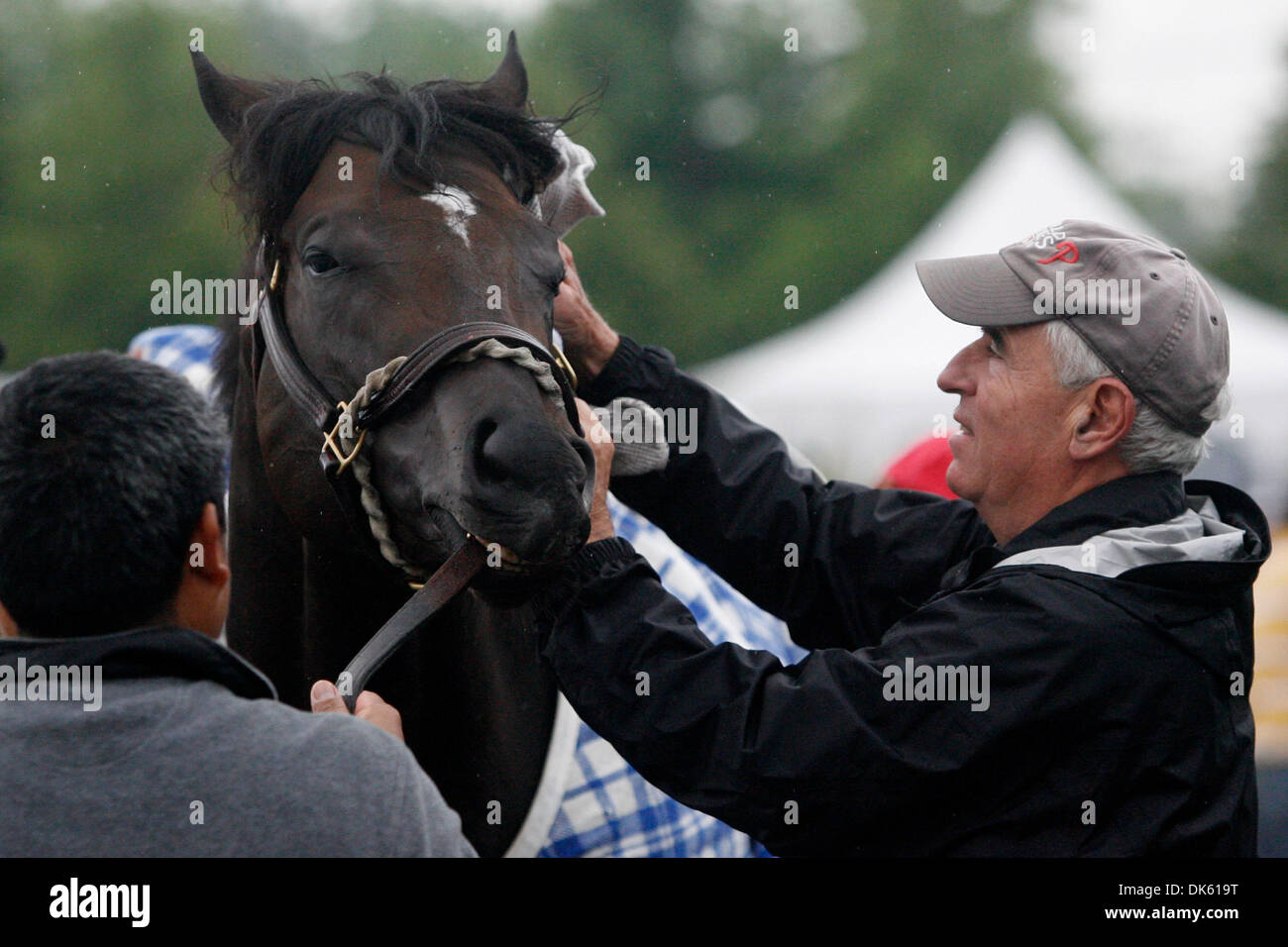 May 20, 2011 - Baltimore, Maryland, U.S. - Trainer NICK ZITO washes off ...