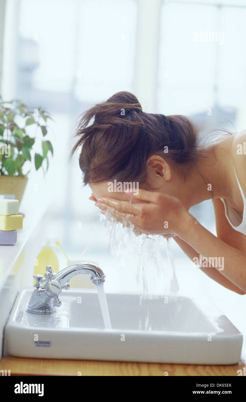 Young Woman Washing Face Stock Photo - Alamy