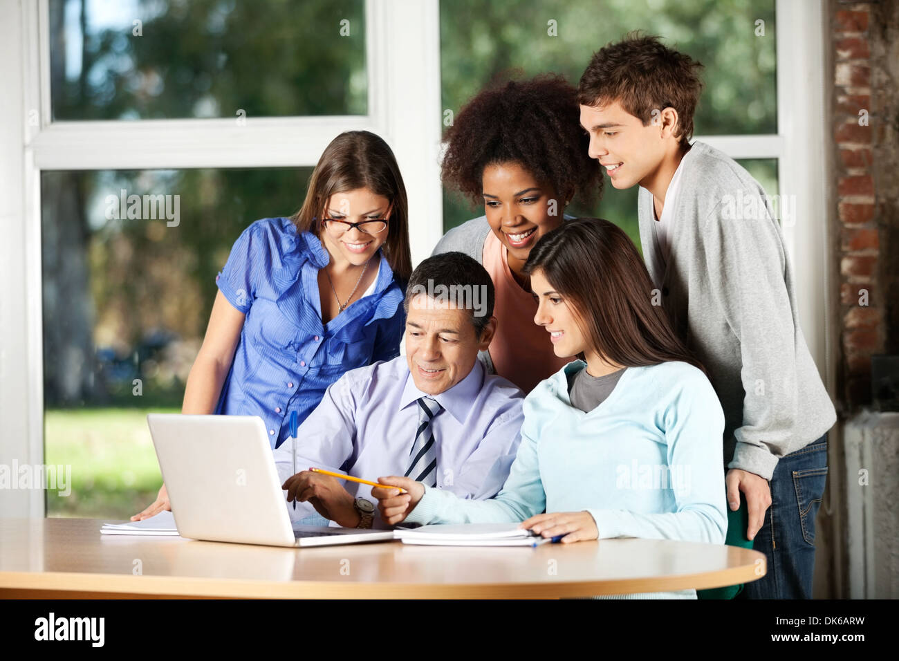 Student group discussion with laptop hi-res stock photography and ...