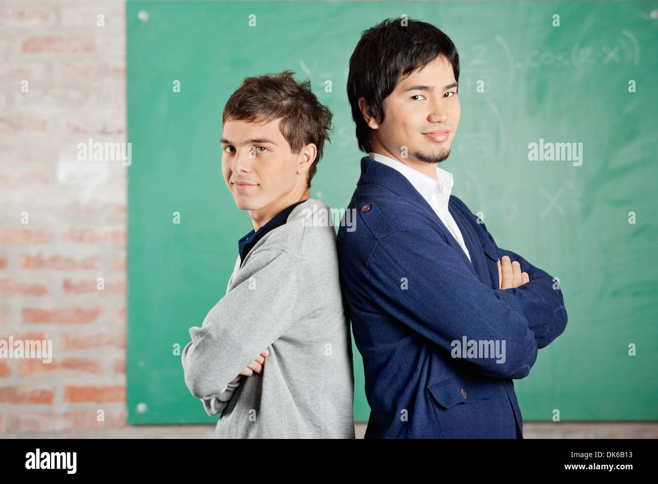 Arms crossed standing education learning classroom blackboard hi-res ...