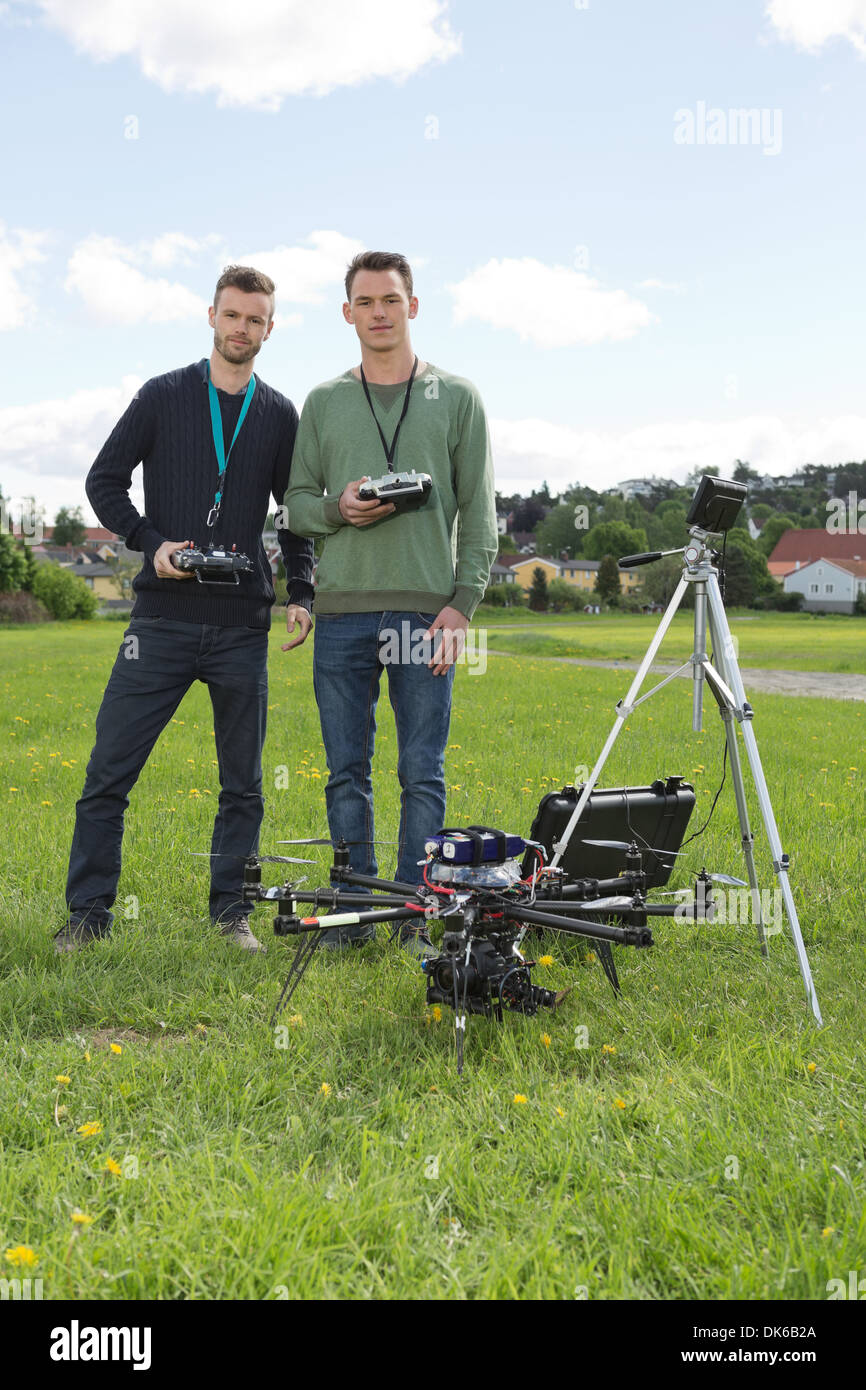 Engineers Holding Remote Controls Of UAV Stock Photo - Alamy