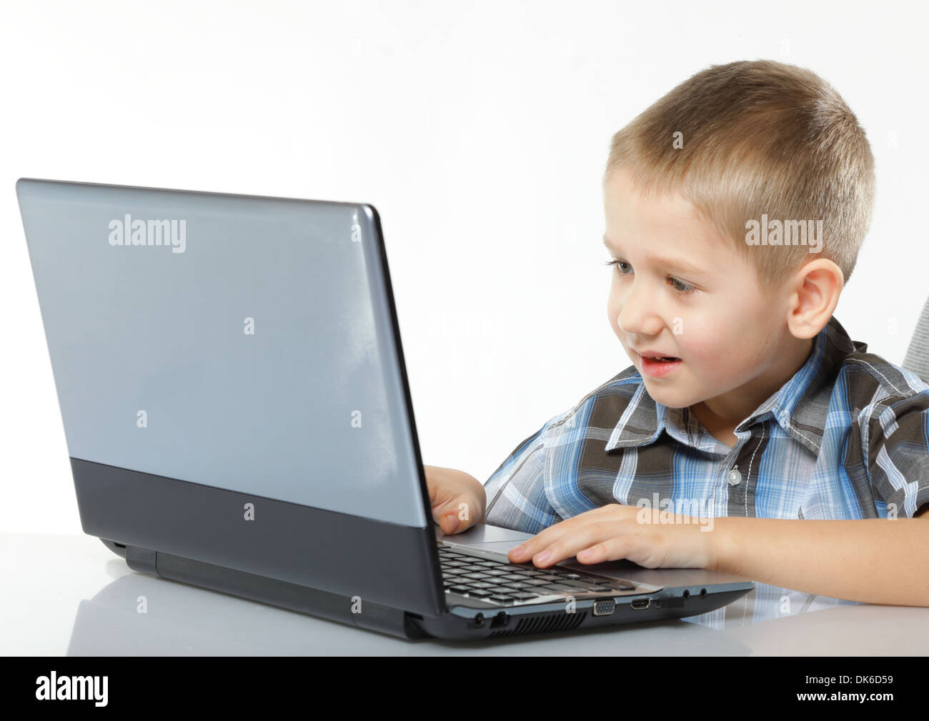 Computer addiction child boy with laptop notebook white background ...