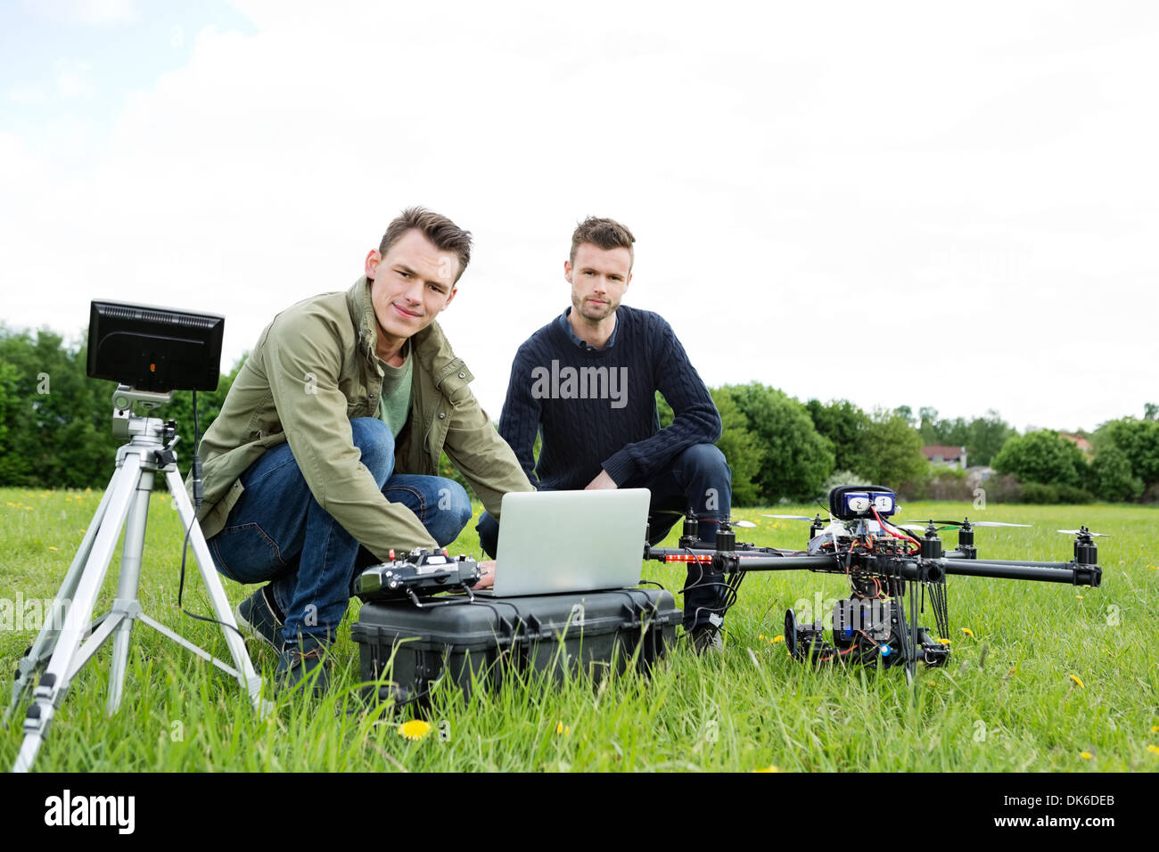 Engineers Using Laptop By UAV Helicopter Stock Photo - Alamy