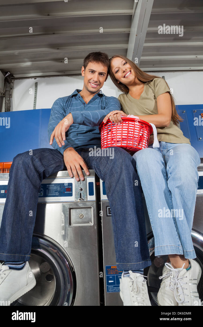 Girl sitting on washing machine hi-res stock photography and images - Alamy