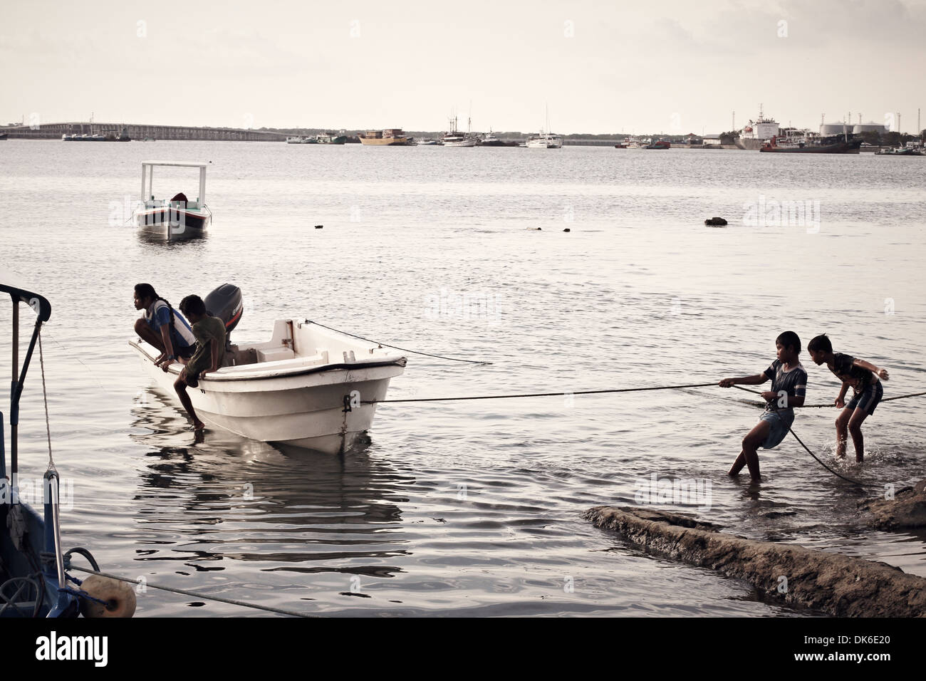 children playing in a boat Stock Photo - Alamy
