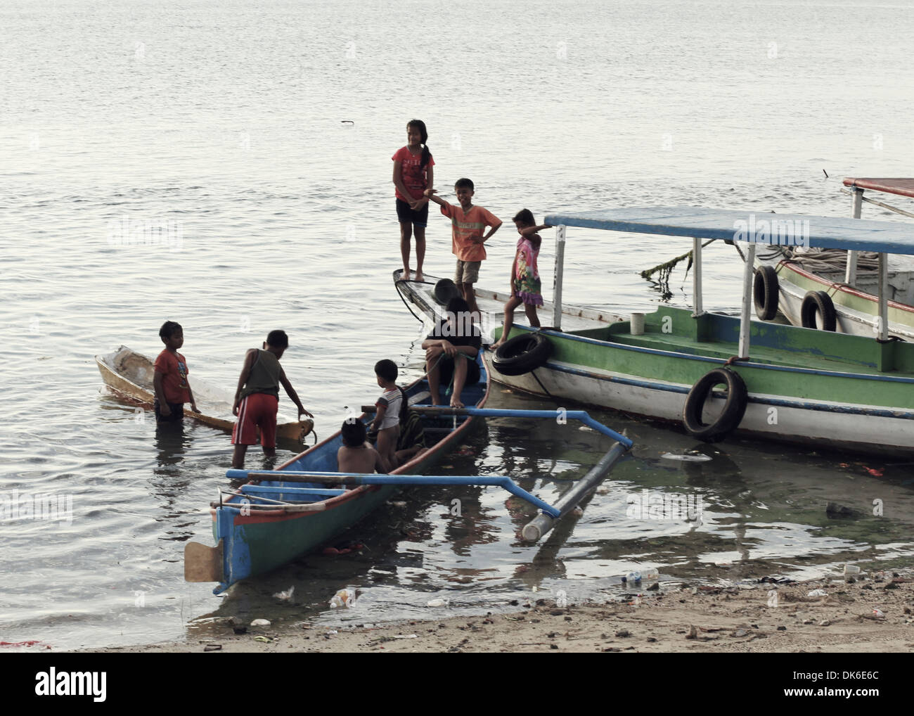 Children playing with boats hi-res stock photography and images - Alamy
