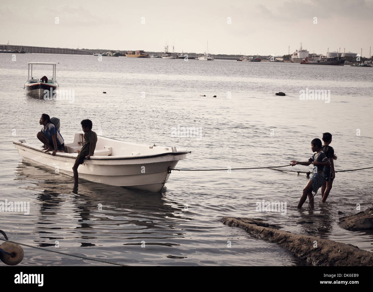 children playing in a boat Stock Photo - Alamy