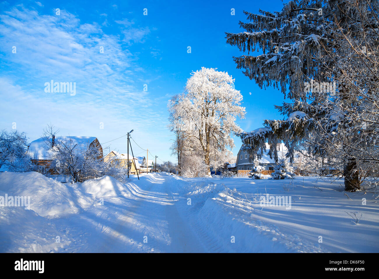 winter rural landscape with the road the forest and the village Stock ...