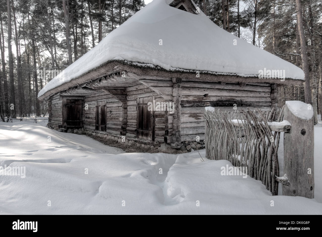 Old blockhouse with thatched roofs in winter in forest Stock Photo - Alamy