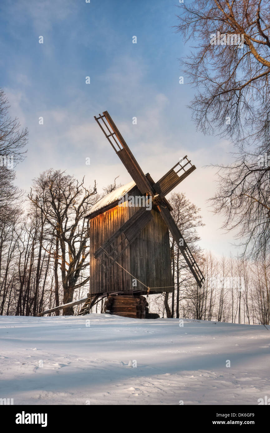Old timber made windmill in forest at winter day Stock Photo - Alamy