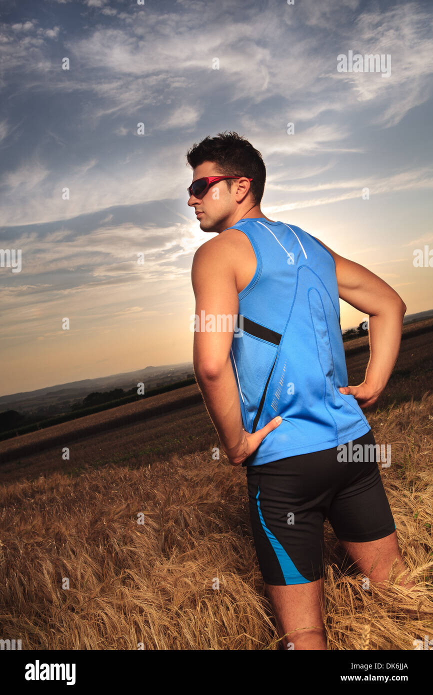 man jogging through the fields Stock Photo - Alamy
