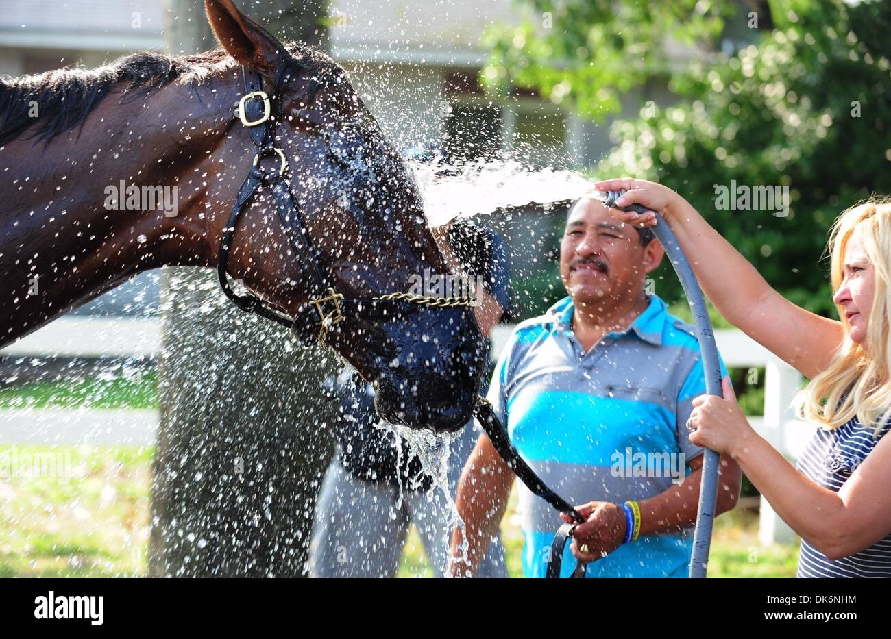 June 8, 2011 - Elmont, New York, U.S. - Trainer KATHY RITVO hoses down ...