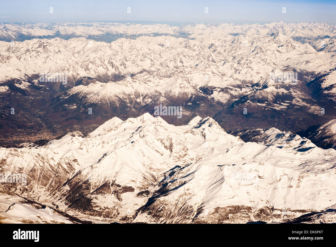 Aerial view of snow capped Alps mountains between Switzerland and Italy ...