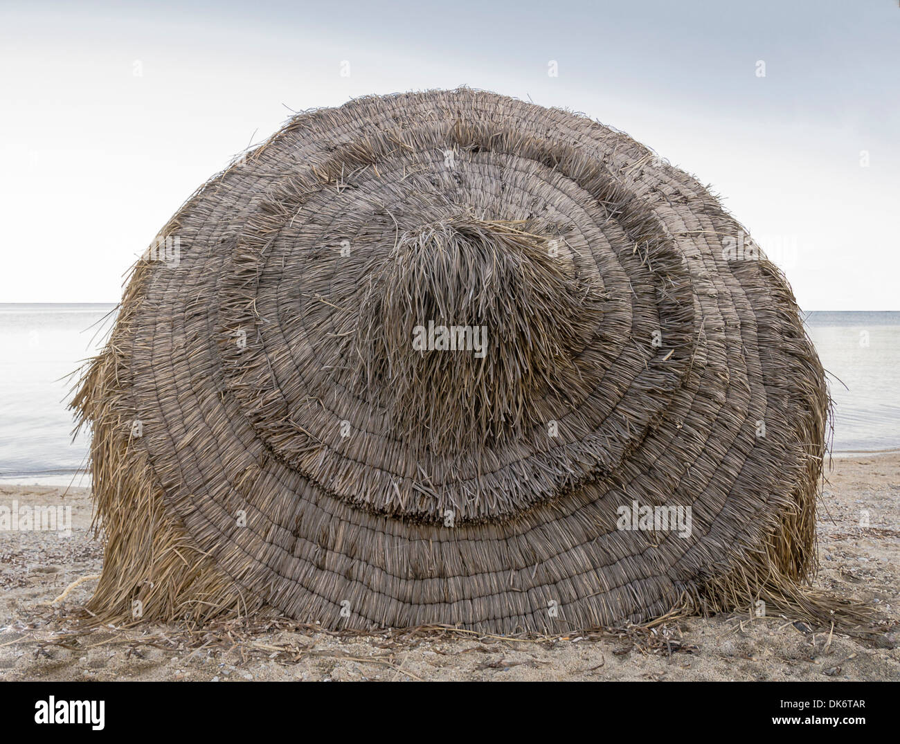 Straw beach umbrella Stock Photo - Alamy