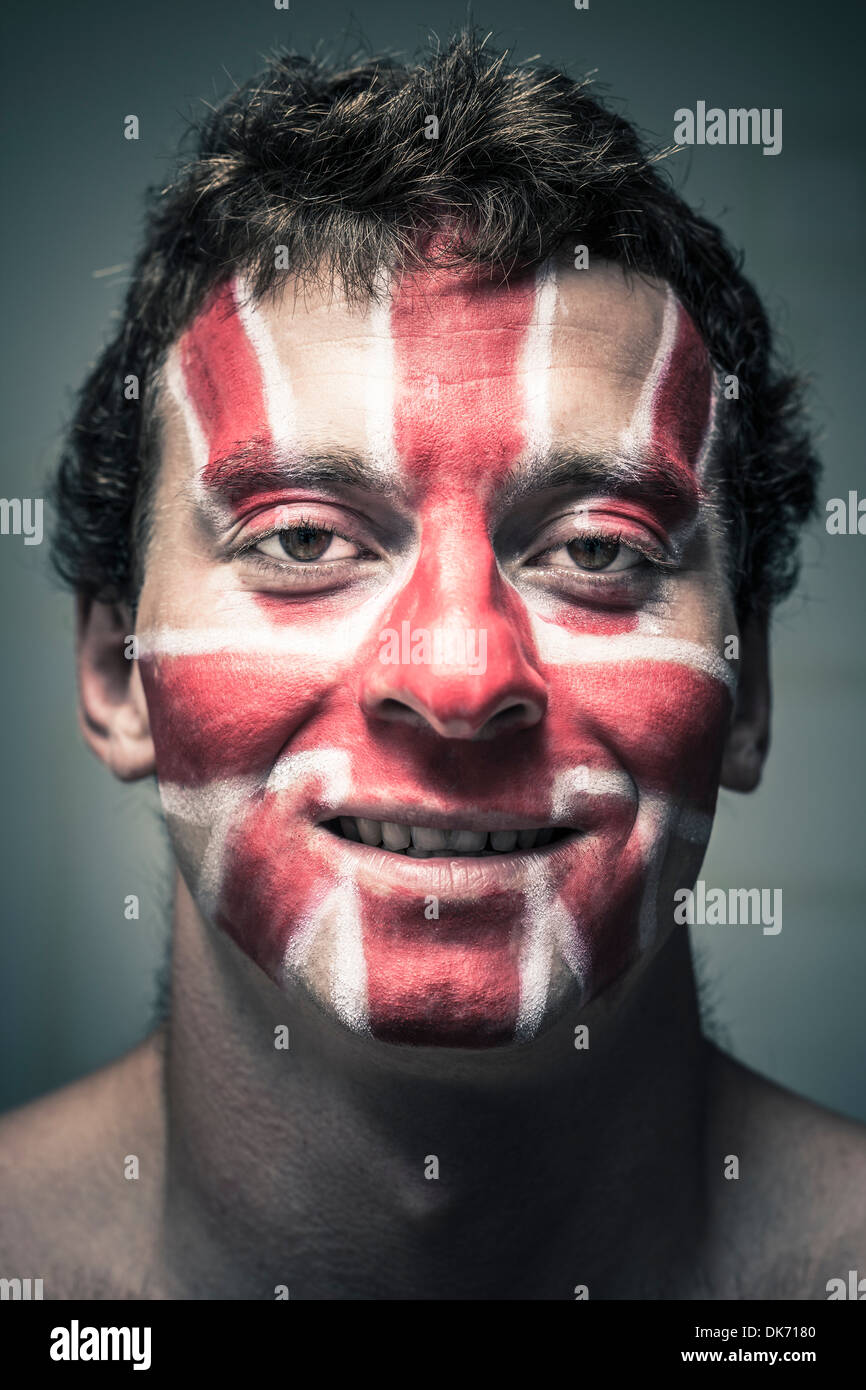 Portrait of smiling man with British flag painted on his face Stock ...