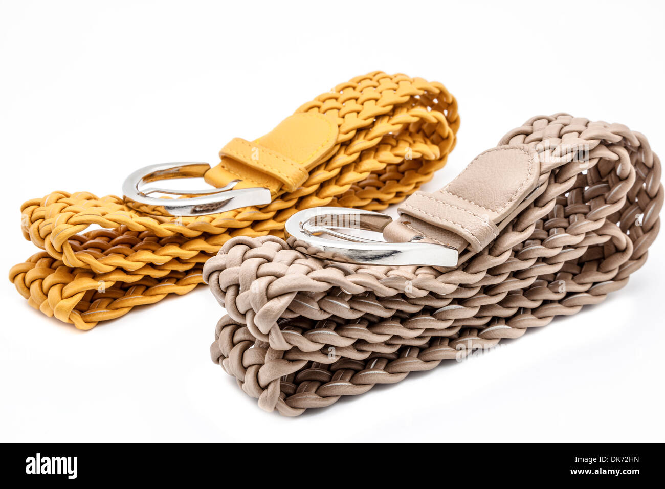 Mustard and grey women belts on a white background Stock Photo - Alamy