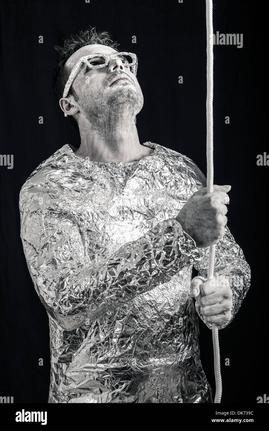 Man holding rope hi-res stock photography and images - Alamy