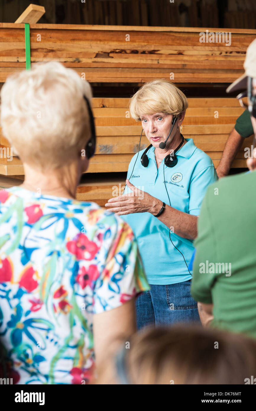 Tour guide leading a tour through the Tiffin Motorhomes factory in Red ...
