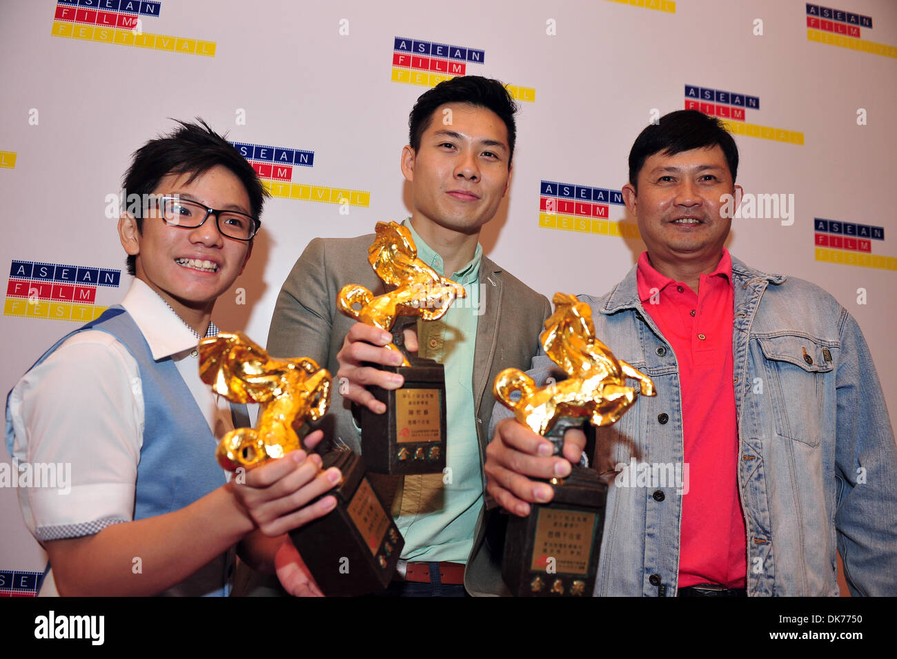 Singapore. 3rd Dec 2013. Singaporean director Anthony Chen (C), actors ...