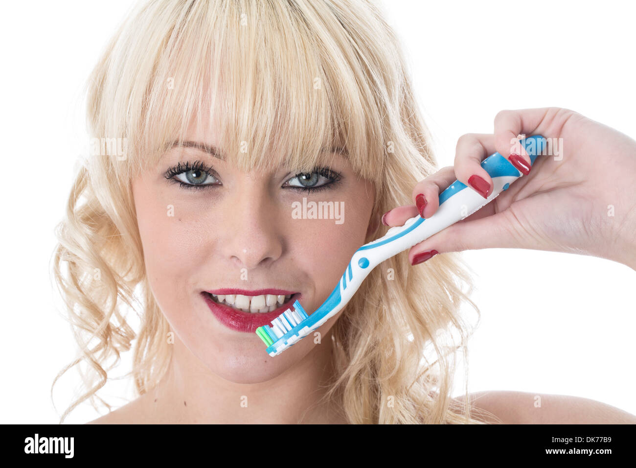 Model Released. Attractive Young Woman Brushing Teeth Stock Photo - Alamy