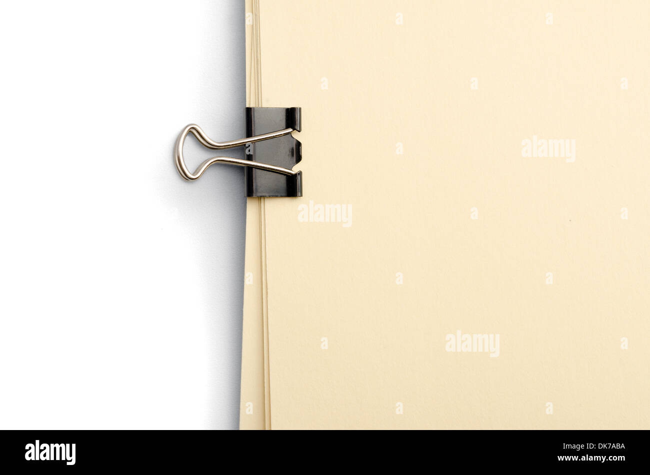 Closeup of a paperclip over a white background Stock Photo - Alamy