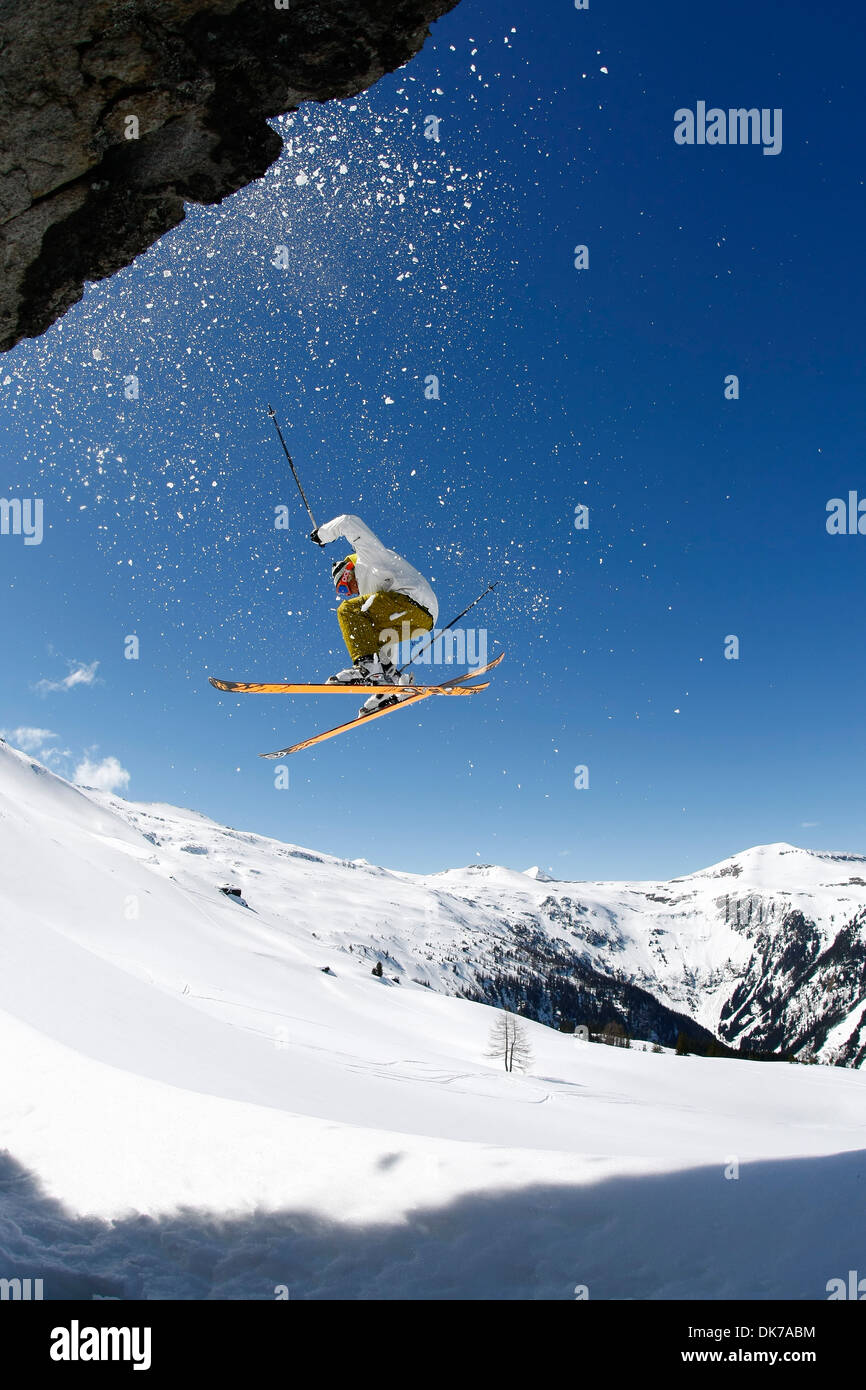 skiier jumping off a cliff in the mountains Stock Photo - Alamy