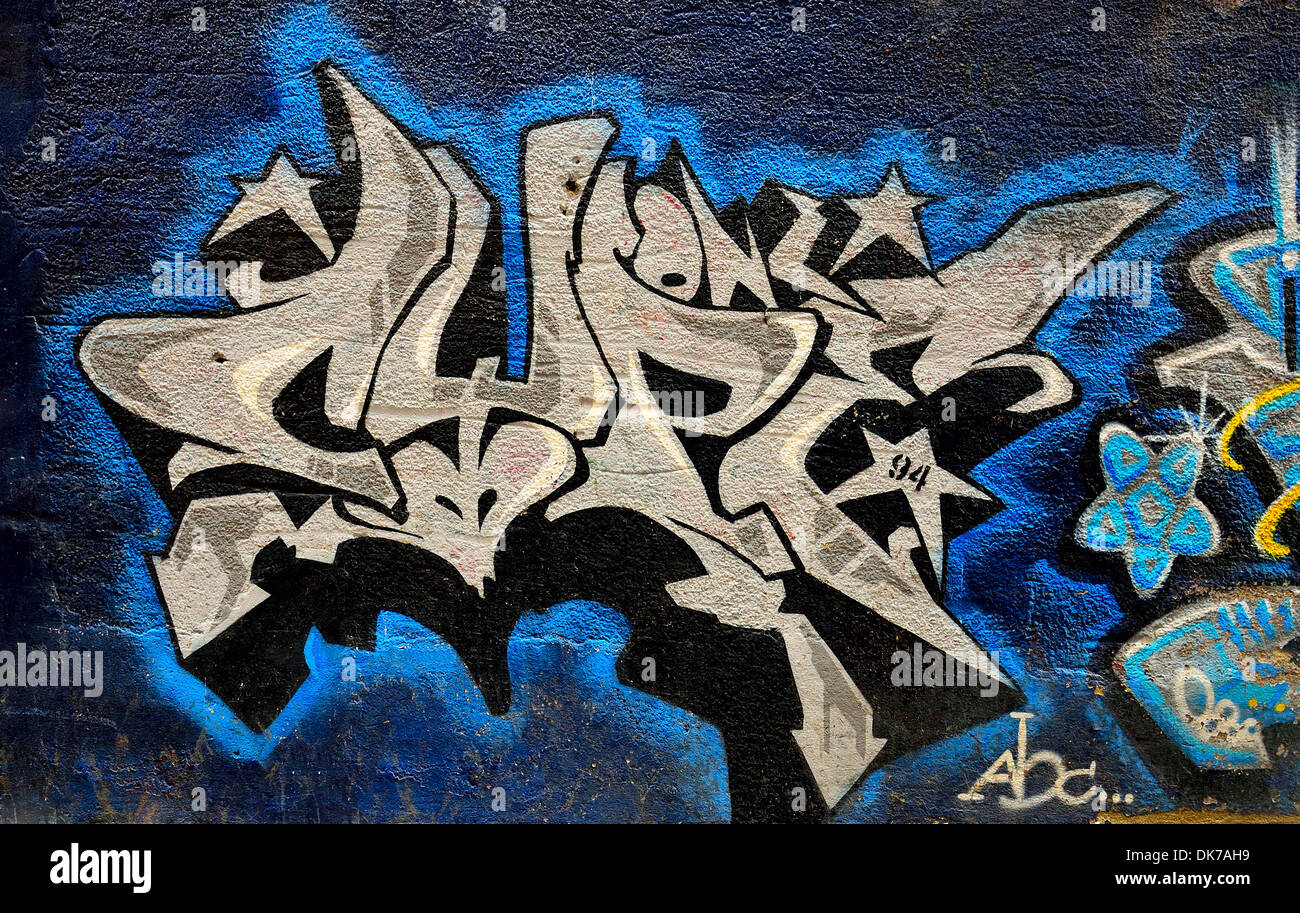 Graffiti painted illegally on public wall Stock Photo - Alamy