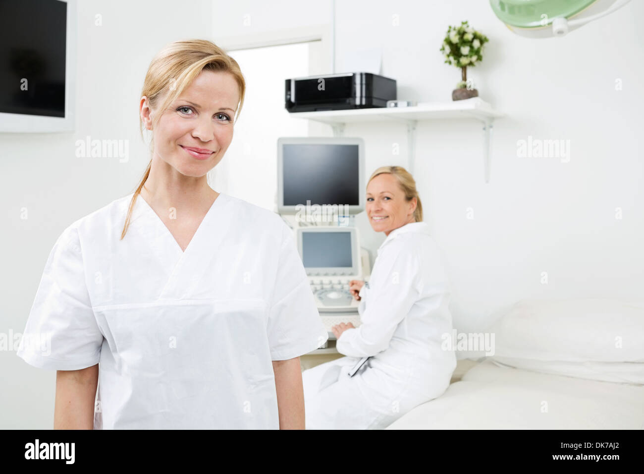 Happy Female Gynecologists In Clinic Stock Photo - Alamy