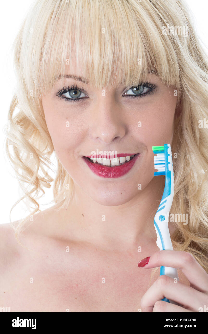 Model Released. Attractive Young Woman Brushing Teeth Stock Photo - Alamy