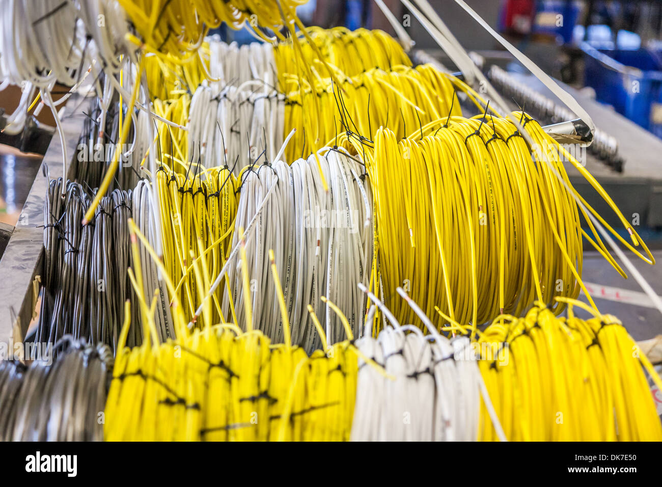 Spools of wire labeled for installation in wiring harness at Tiffin ...