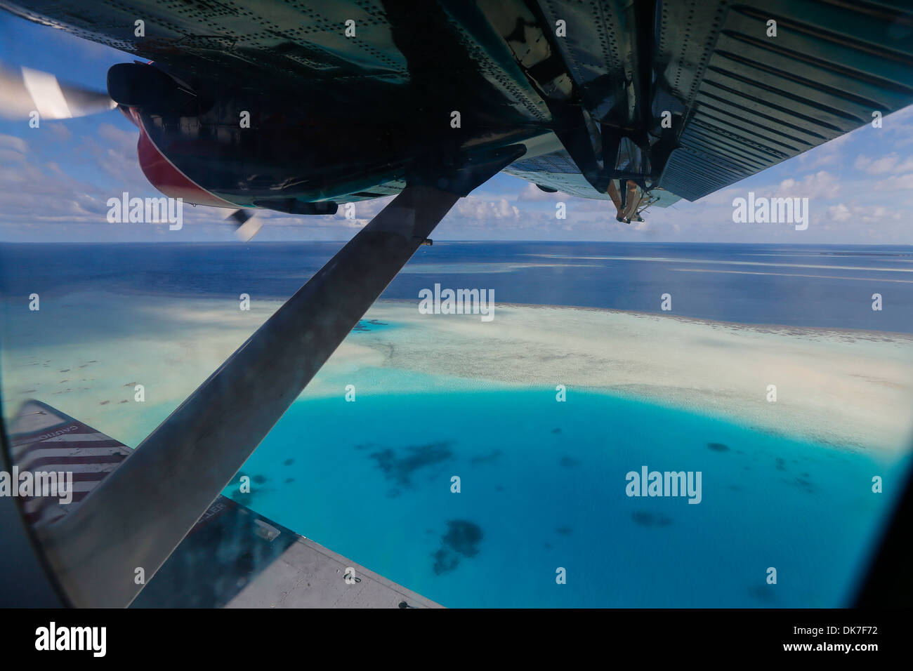 water plane flying over maldives blue water Stock Photo - Alamy