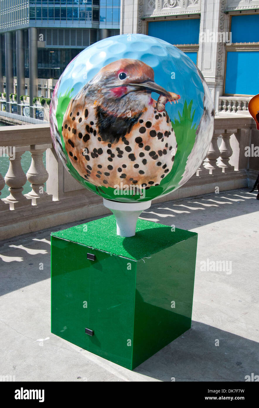 Aiding Green A series of giant golf balls on display in Chicago’s ...
