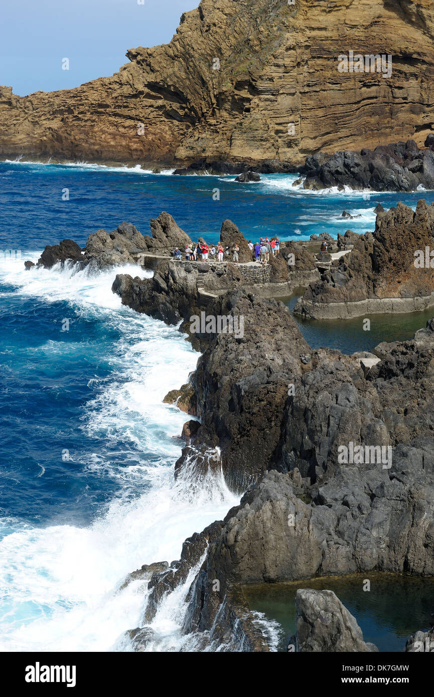 Madeira Portugal. Tourists visiting the lava pools in the coastal ...
