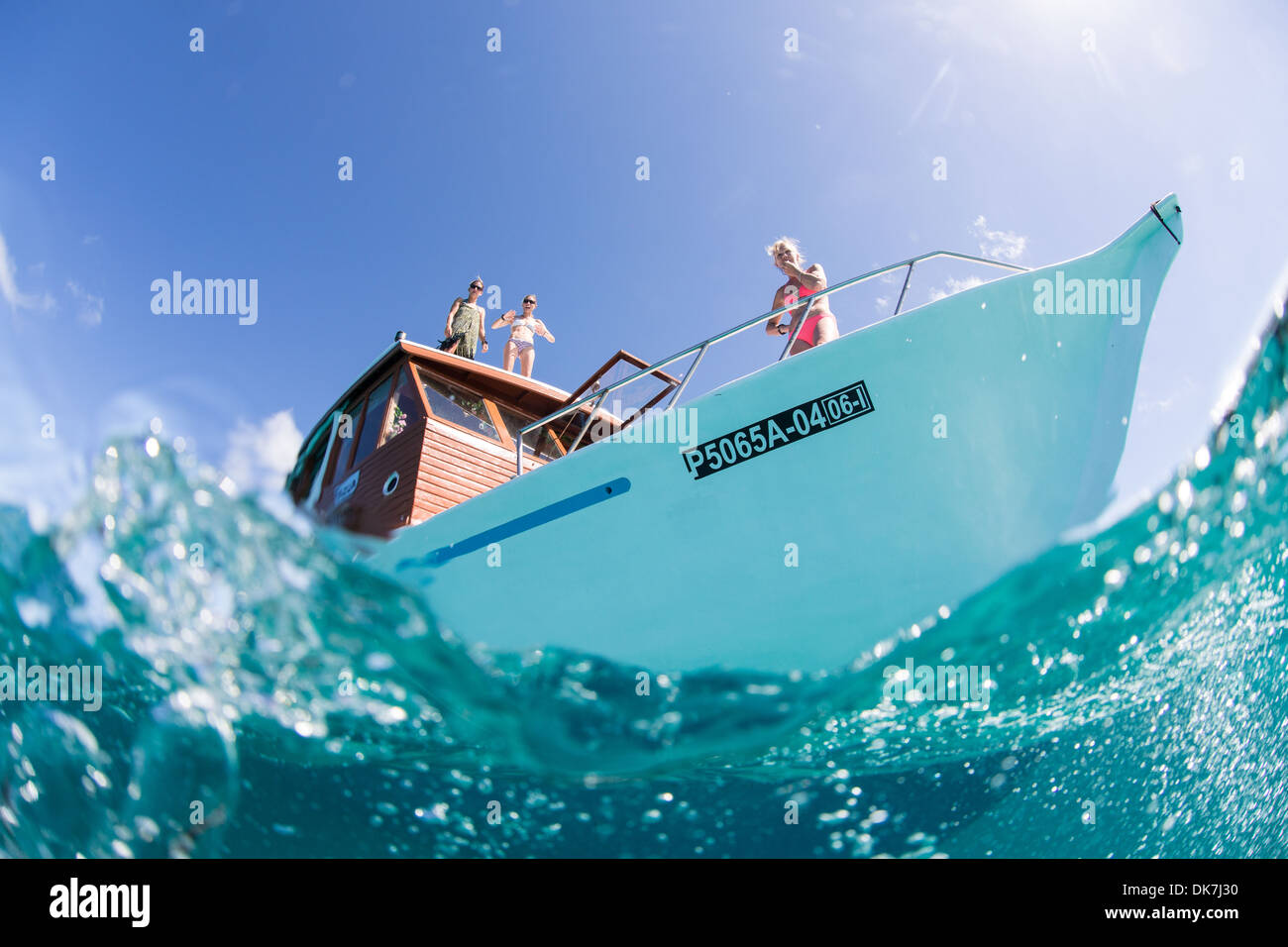 People watch from small boat Stock Photo - Alamy