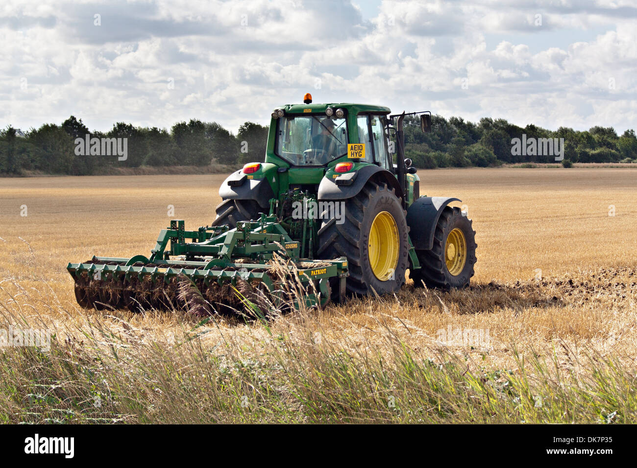 John deere tractor harrowing fenland hi-res stock photography and ...