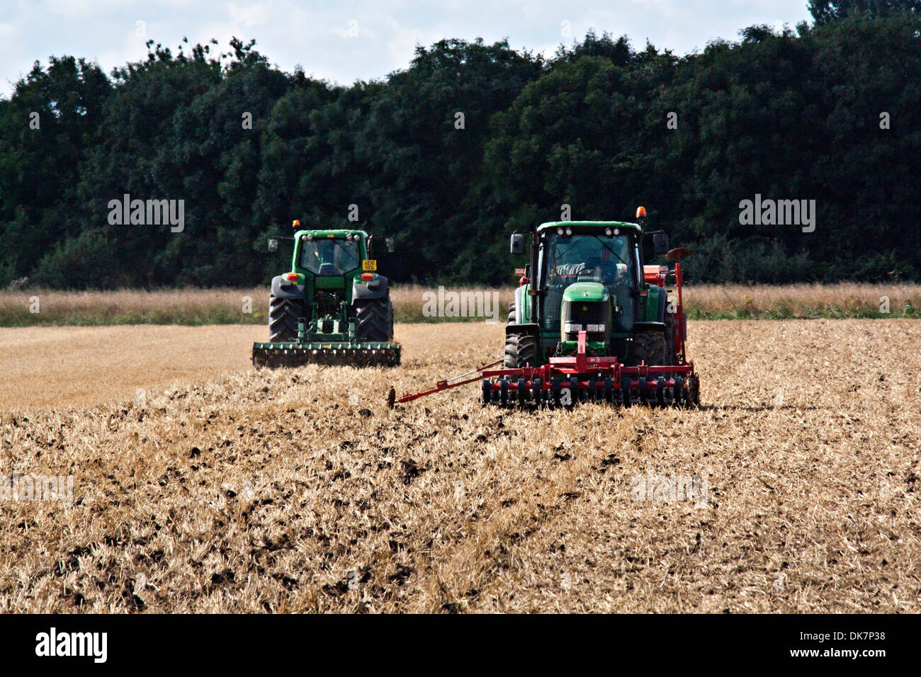 John Deere tractor harrowing Fenland field Stock Photo - Alamy