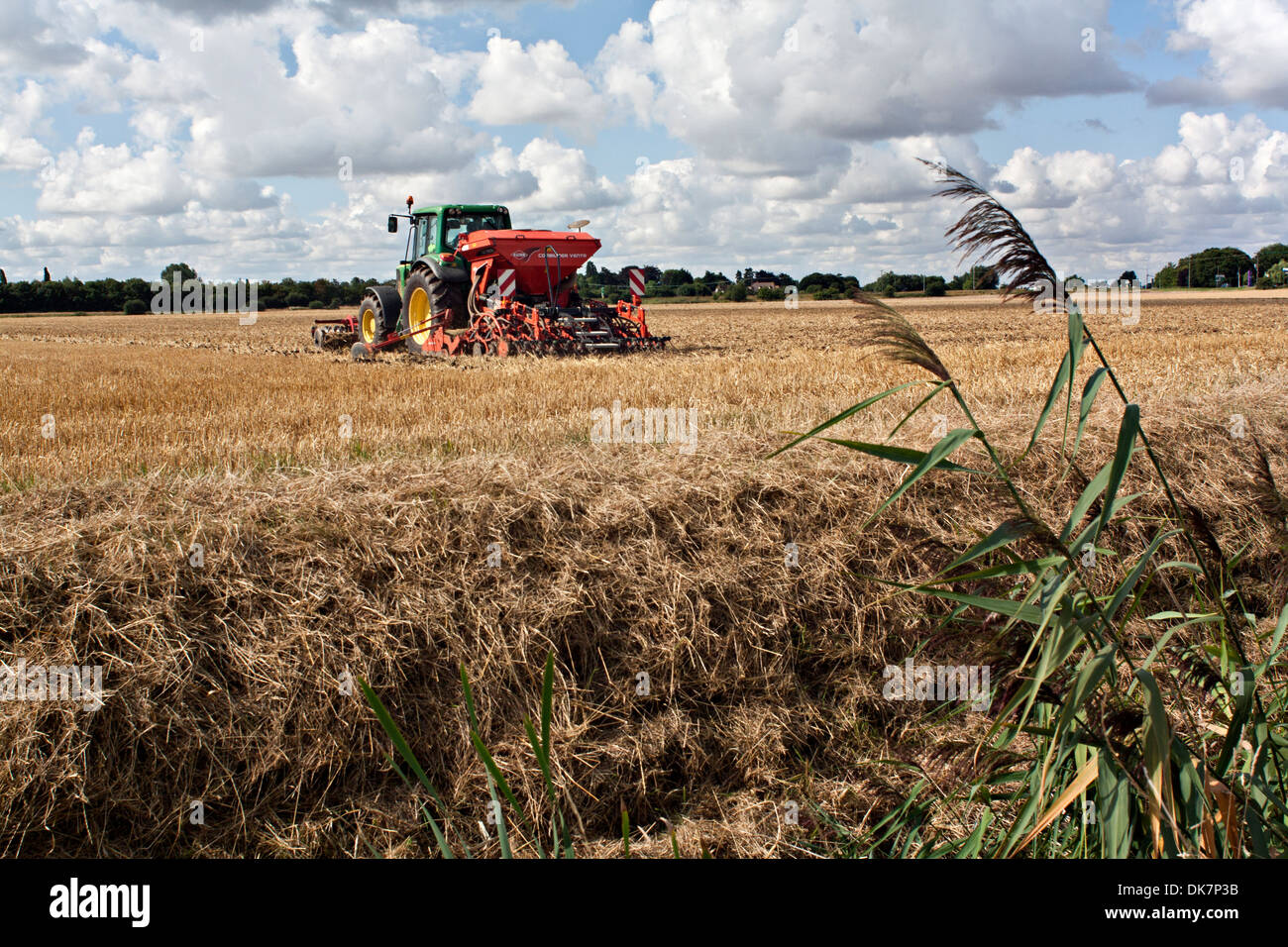 John Deere tractor harrowing Fenland field Stock Photo - Alamy